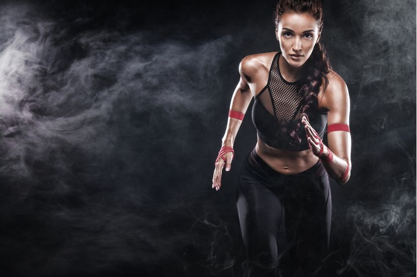 Athletic Woman Running On Black Background Wall Mural - Murals Your Way
